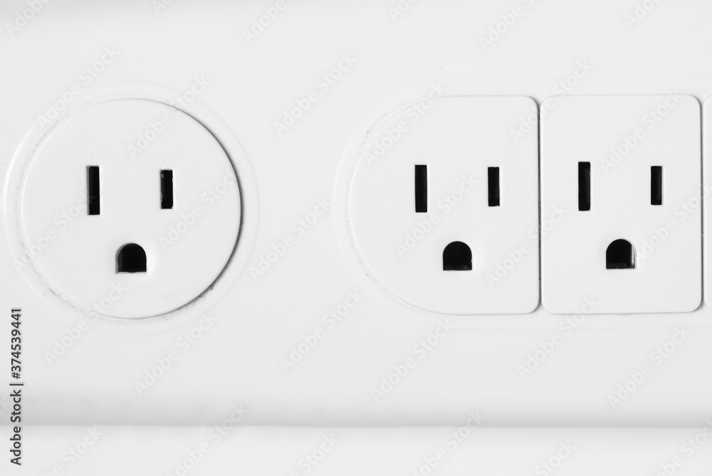 Original photograph of the outlets in a power strip appearing to be ...