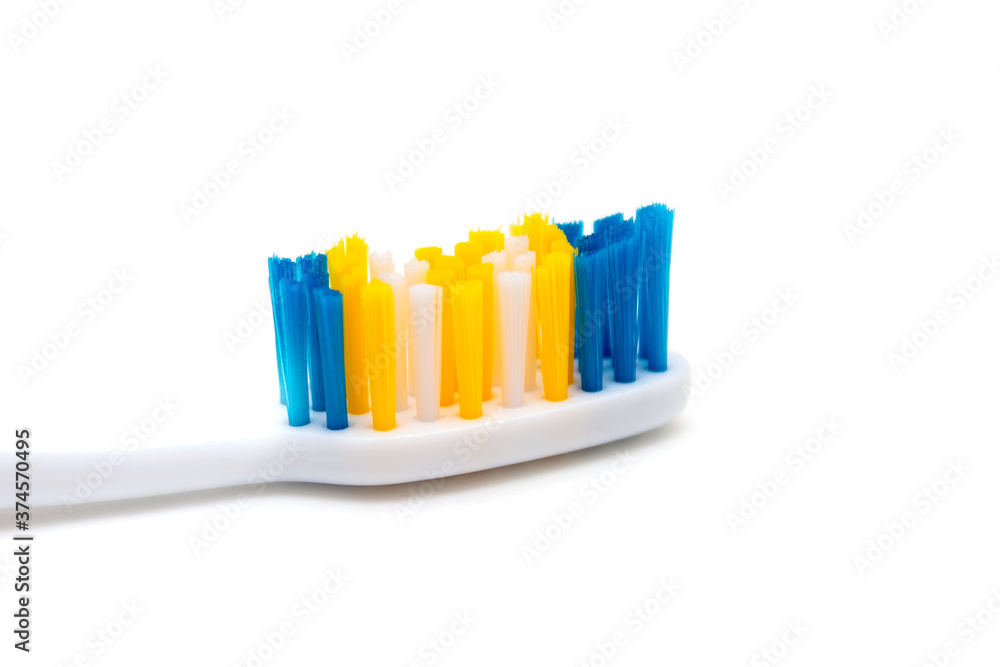 White background on it toothbrushes of different colors are arranged in ...