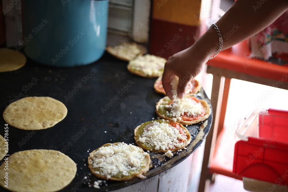 Sopes con queso verdes y rojos, fonda mexicana. mexico Stock Photo ...