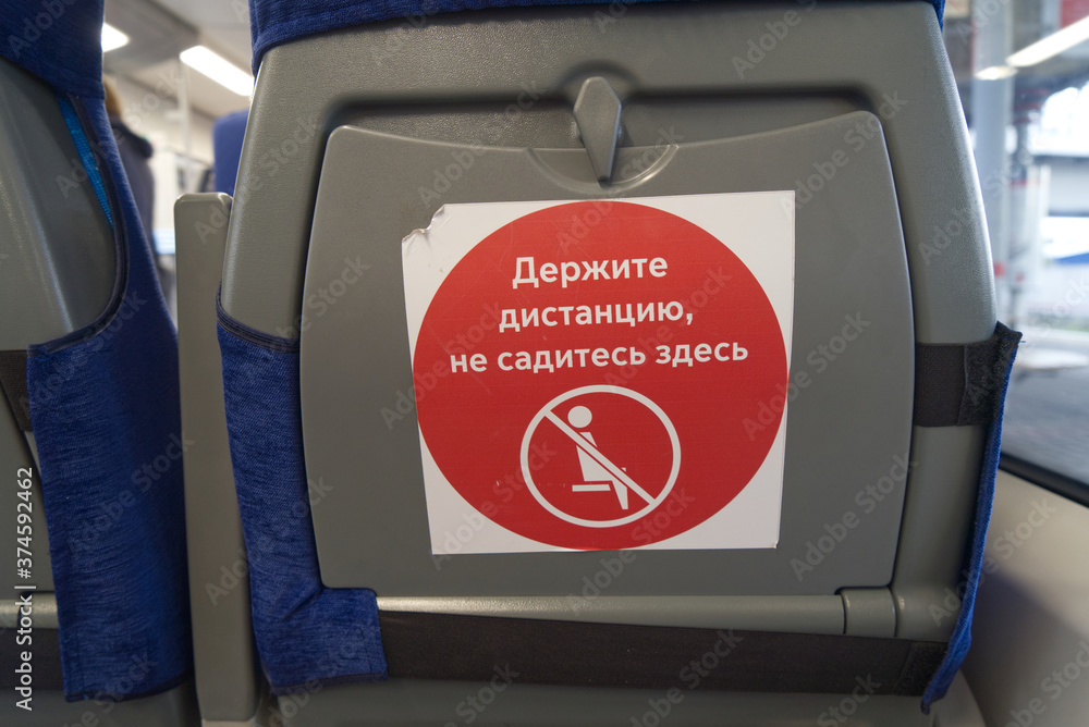 sign "keep your distance, do not sit here" on the back of the seat ...