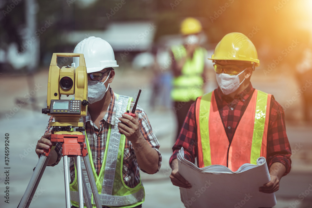 Engineering team surveying on the construction site Stock Photo | Adobe ...