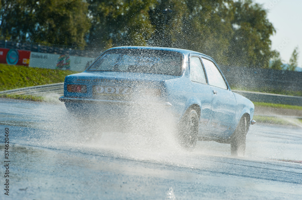 Opel Kadett, Series C, vintage german compact car on a wet track in ...