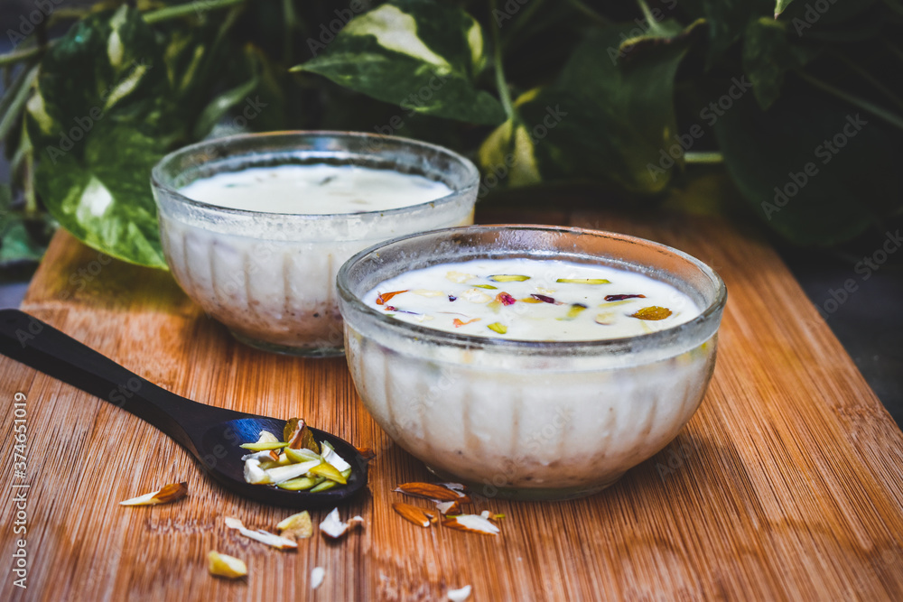 Indian sweet dish popularly known as Kheer or Rice Pudding in bowl on ...
