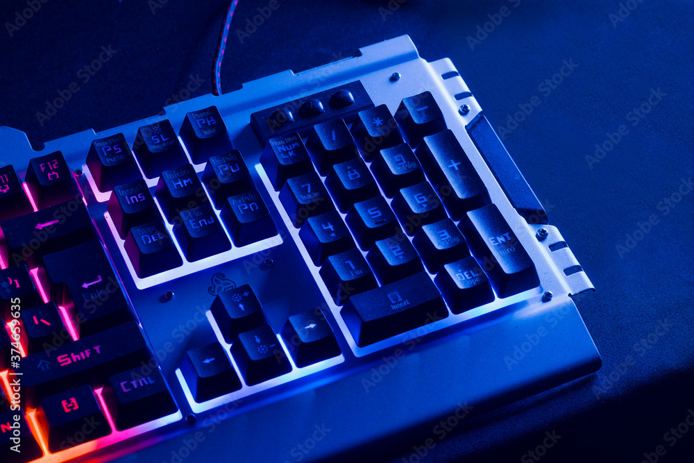 Gamer keyboard with blue backlight and red background light, modern ...