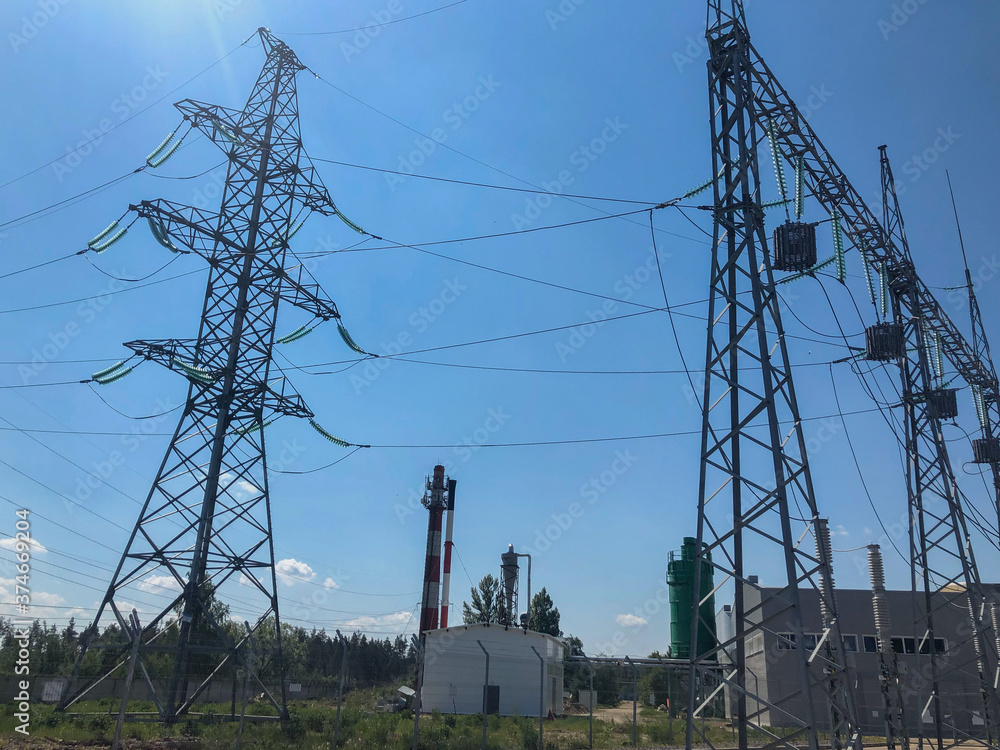 Power plant and power lines. Electricity is essential for all areas of ...
