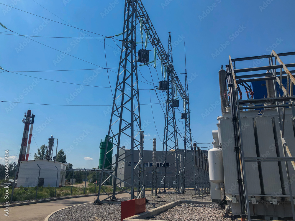 Power plant and power lines. Electricity is essential for all areas of ...
