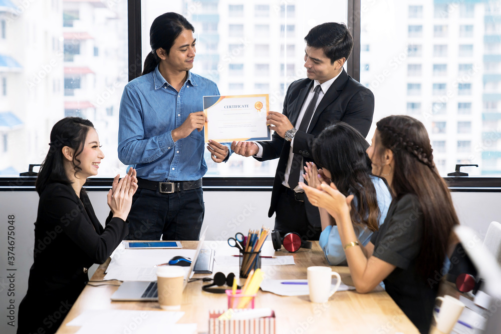 Business executives congratulate employees on their excellent work ...