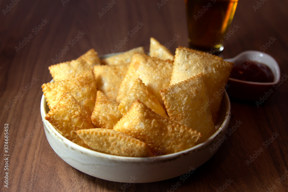 Foto de Brazilian snack Mini pasteis . Deep fried pastry. Traditonal ...