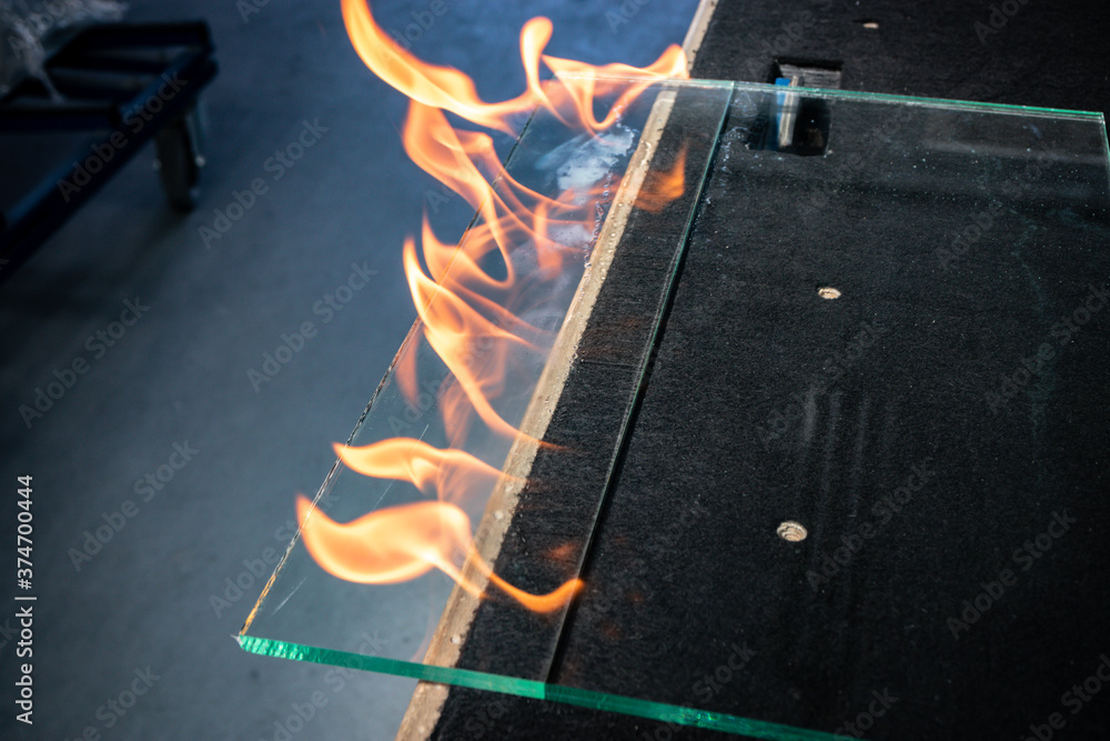 Burning glass. Professional cutting of safety glass called VSG (Very ...