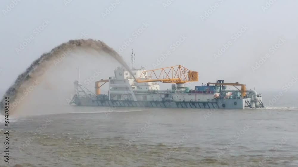 Dredging Vessel in action to keep waterways navigable, excavate and ...