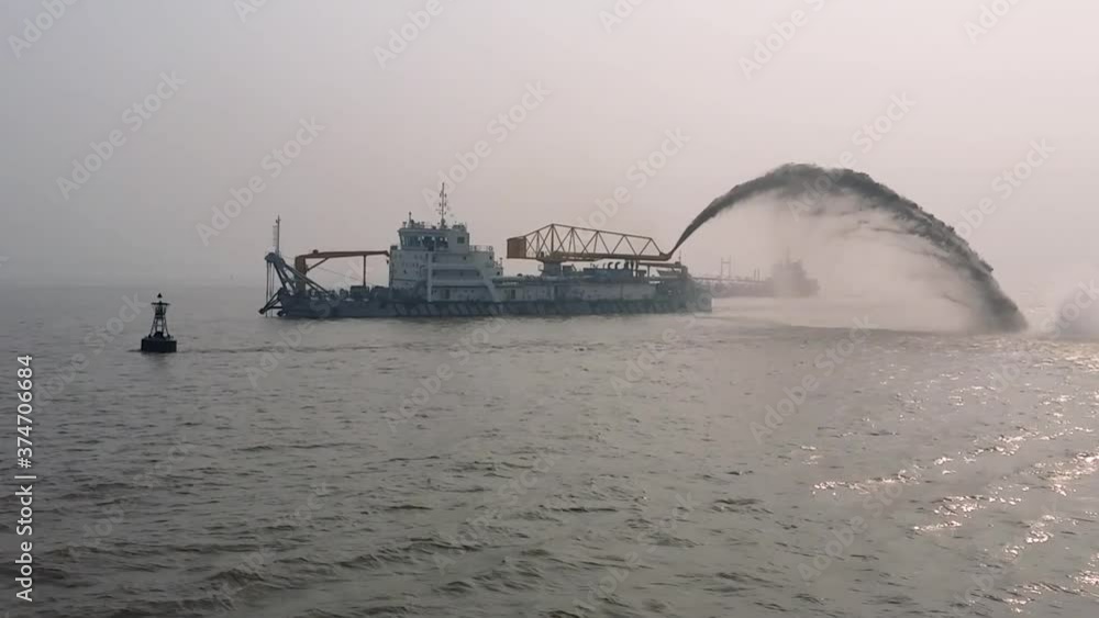 Dredging Vessel in action to keep waterways navigable, excavate and ...