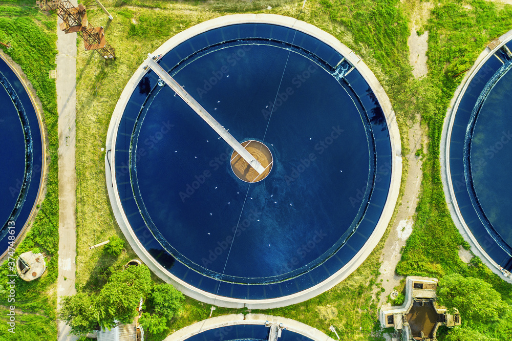 Aerial top view of sewage treatment plant. Water treatment in round ...