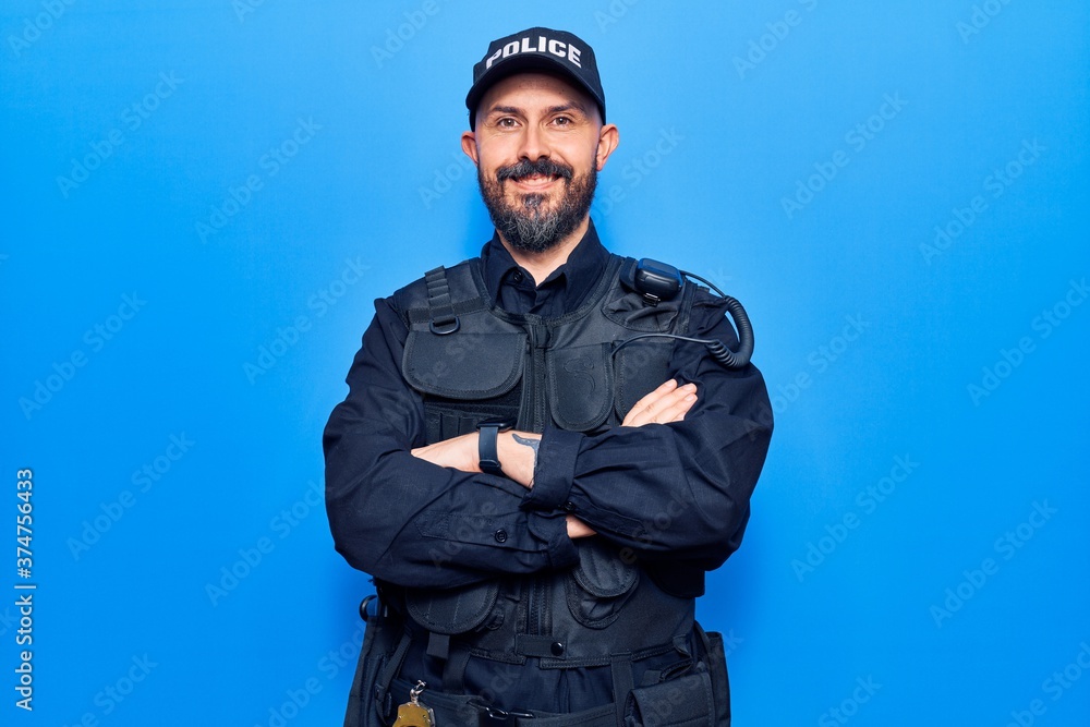Young handsome man wearing police uniform happy face smiling with ...