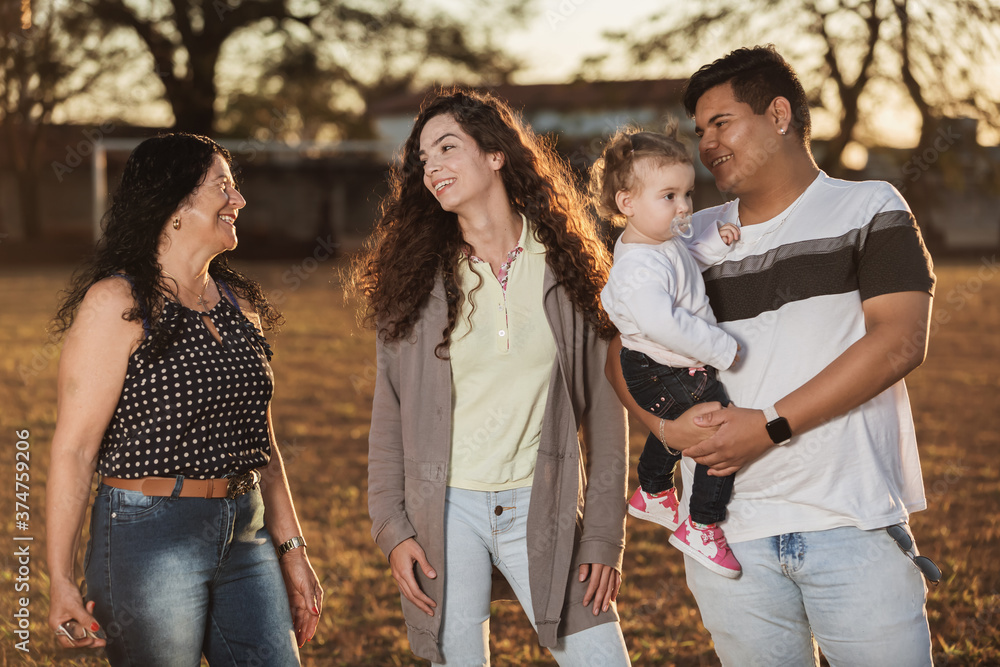 Happy three family generations playing together, smiling senior ...