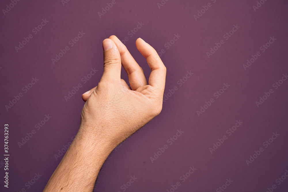 Hand of caucasian young man showing fingers over isolated purple ...