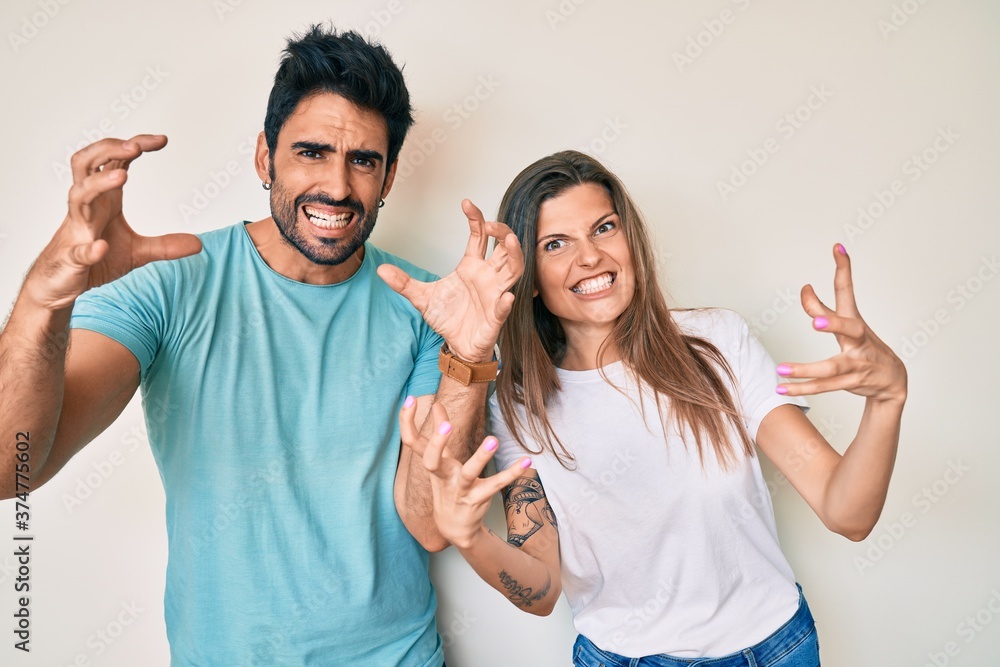 Beautiful young couple of boyfriend and girlfriend together shouting ...