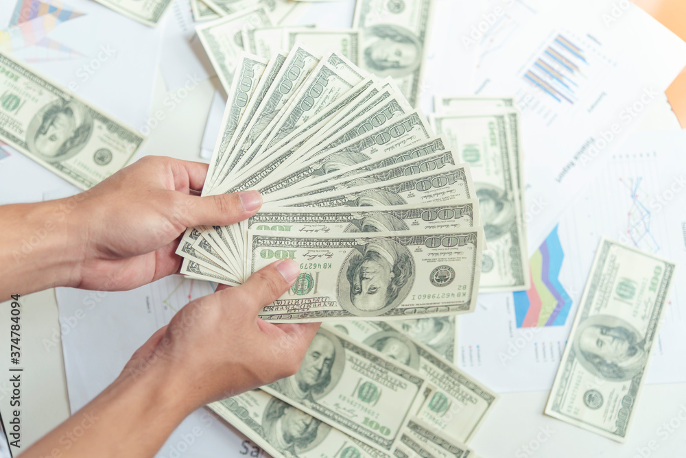 Hand holding loan money dollar bank note give financial payment. Man ...