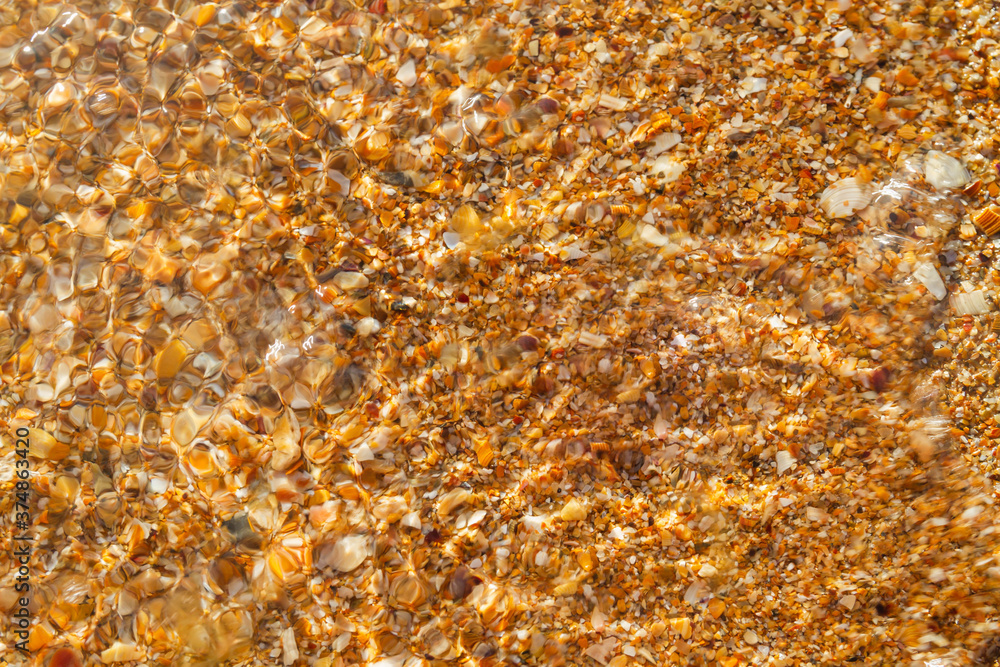 Wet yellow sand on the beach. Beautiful texture of Golden sand with a ...