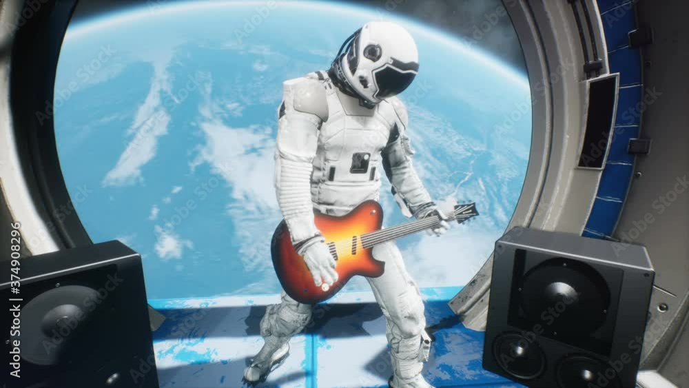 An astronaut on his spaceship plays space music on an electric guitar ...