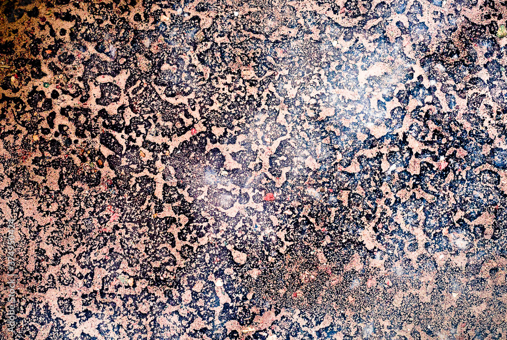 Abstract background. Asphalt concrete pavement through a layer of water ...