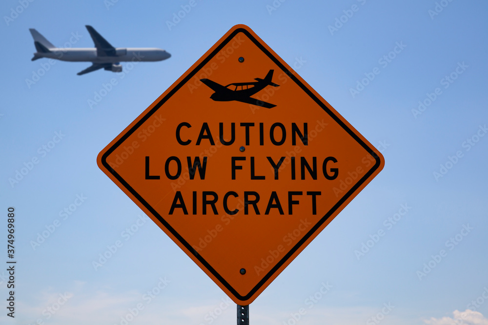 Road sign near a local airfield which says 'Caution low flying aircraft ...