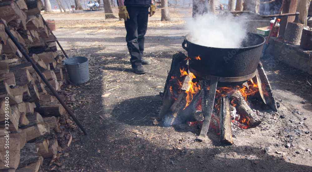 Making Maple Syrup: Reducing Sap in Boiling Cauldron Over Fire Stock ...