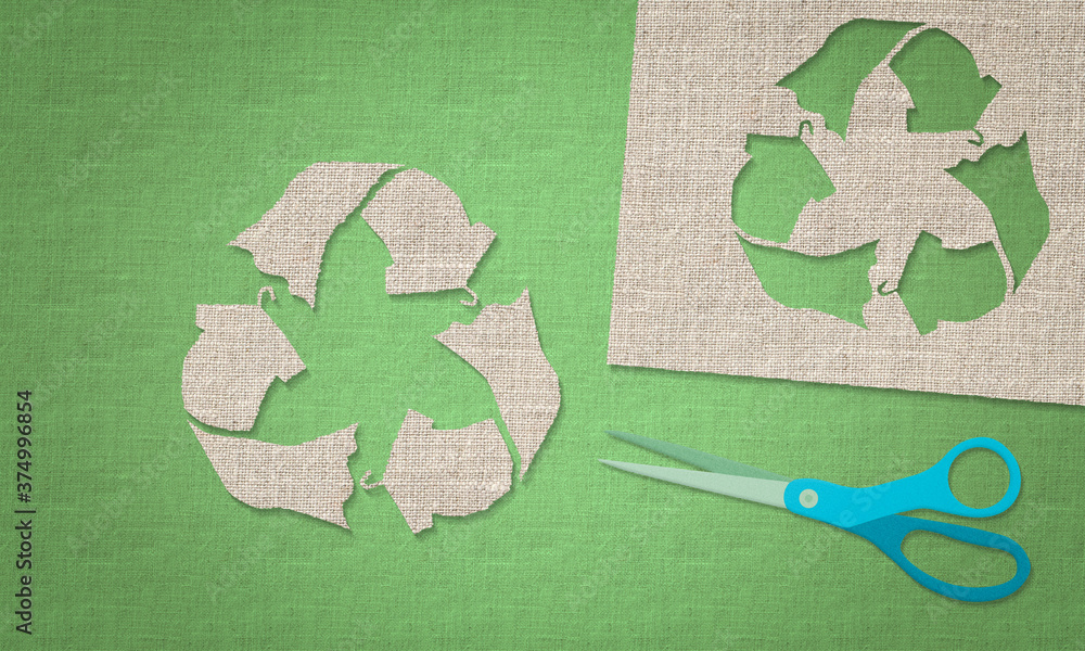 recycle clothes symbol recycle sign cut from reuse fabric on a textile ...
