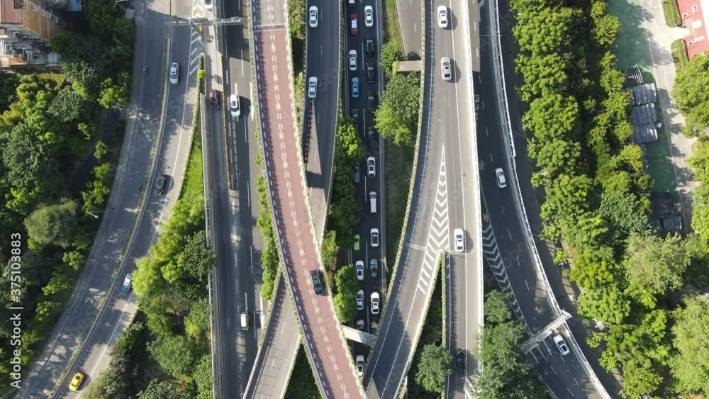 Drone aerial view of curved overpass multi lane highways junction in ...
