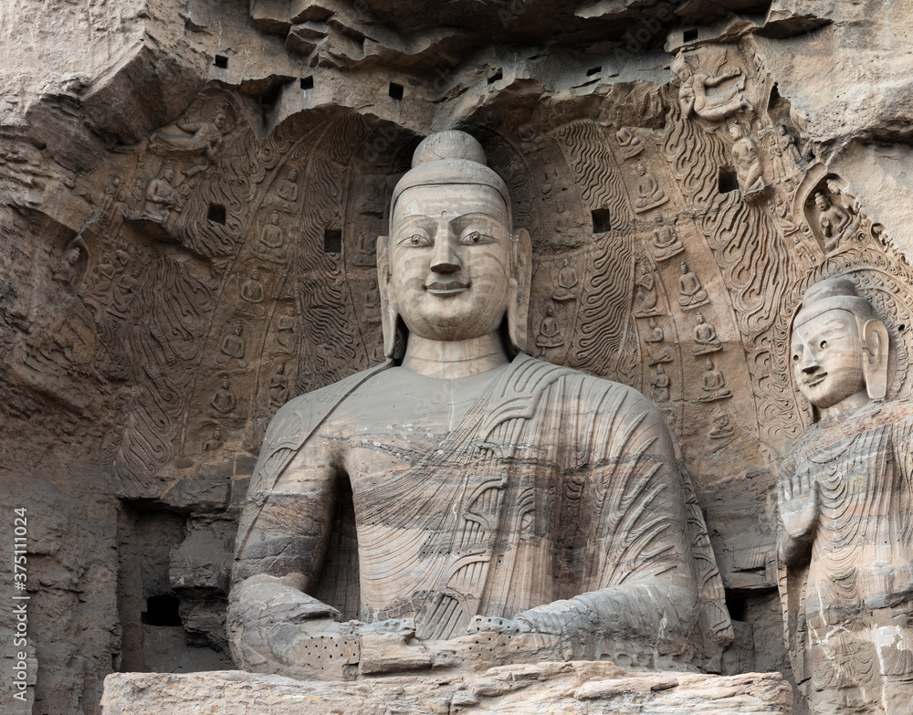 Iconic seated Buddha statue and smaller standing Buddha on right in ...