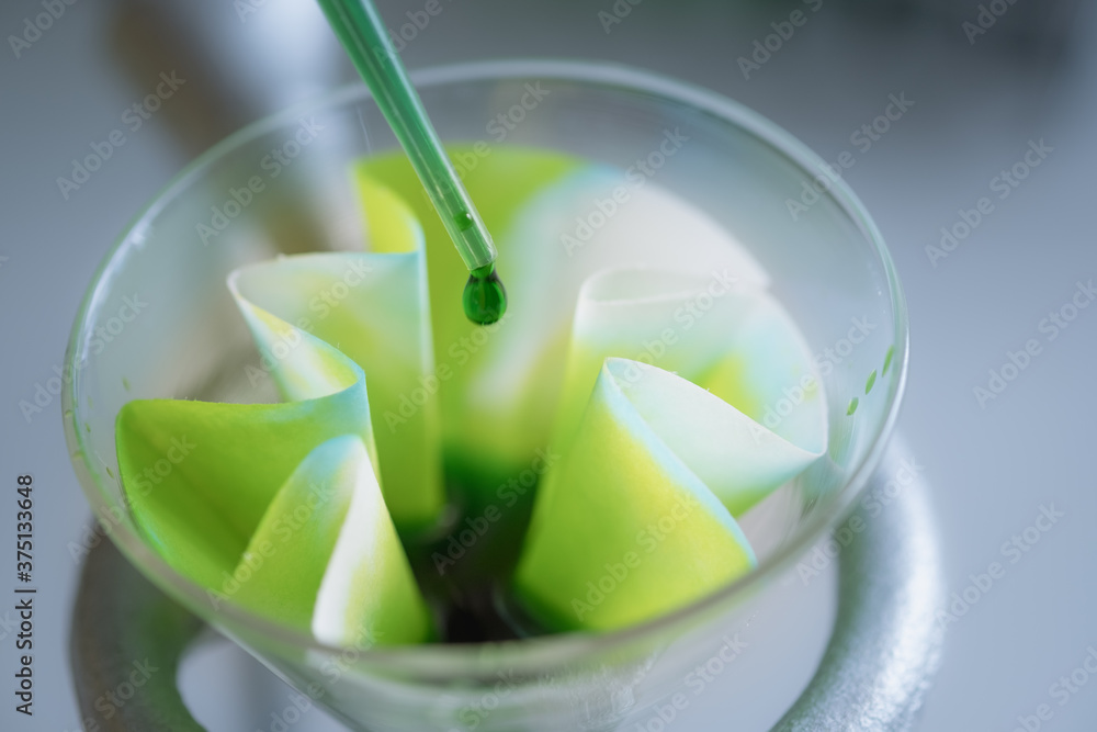 The Scientist Is Testing The Natural Product Extraction And Green Color Solution In The