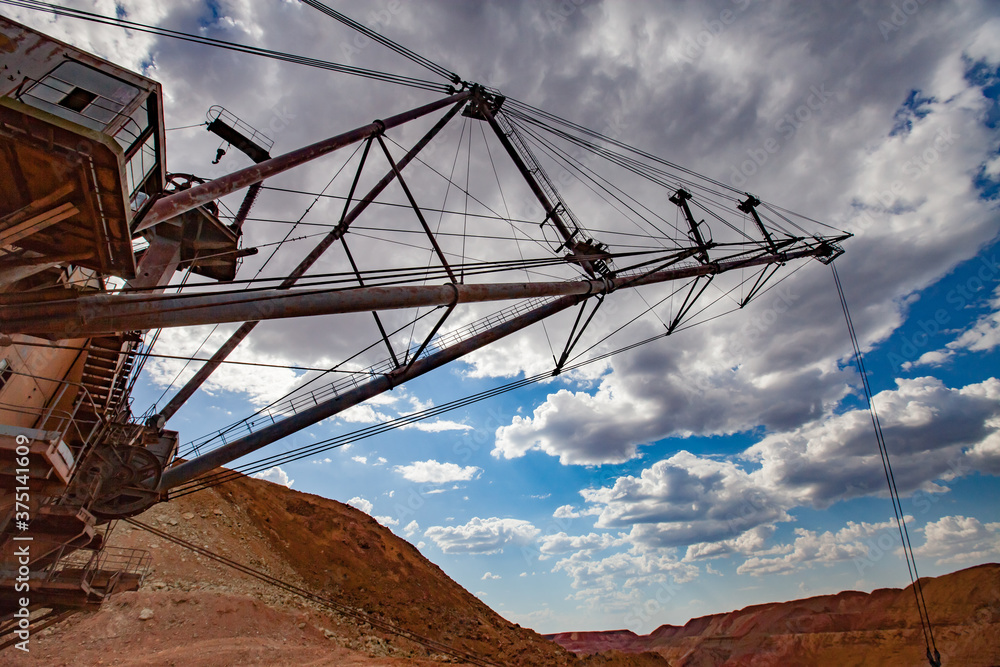 Aluminium ore quarry. Bauxite clay open-cut mining. Walking dragline ...