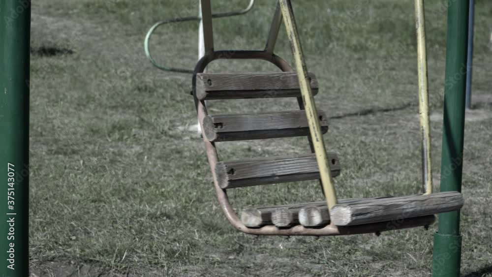 Video Stock Old metal swing for children. carousel is moving. Empty ...