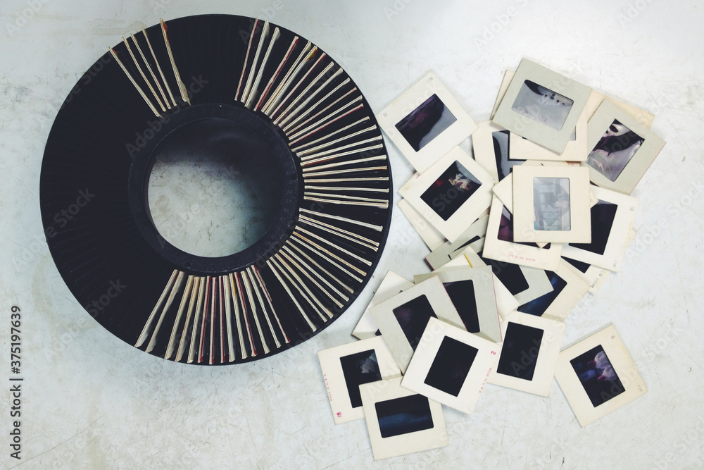 Vintage 35mm film slides on an old white table Stock Photo | Adobe Stock