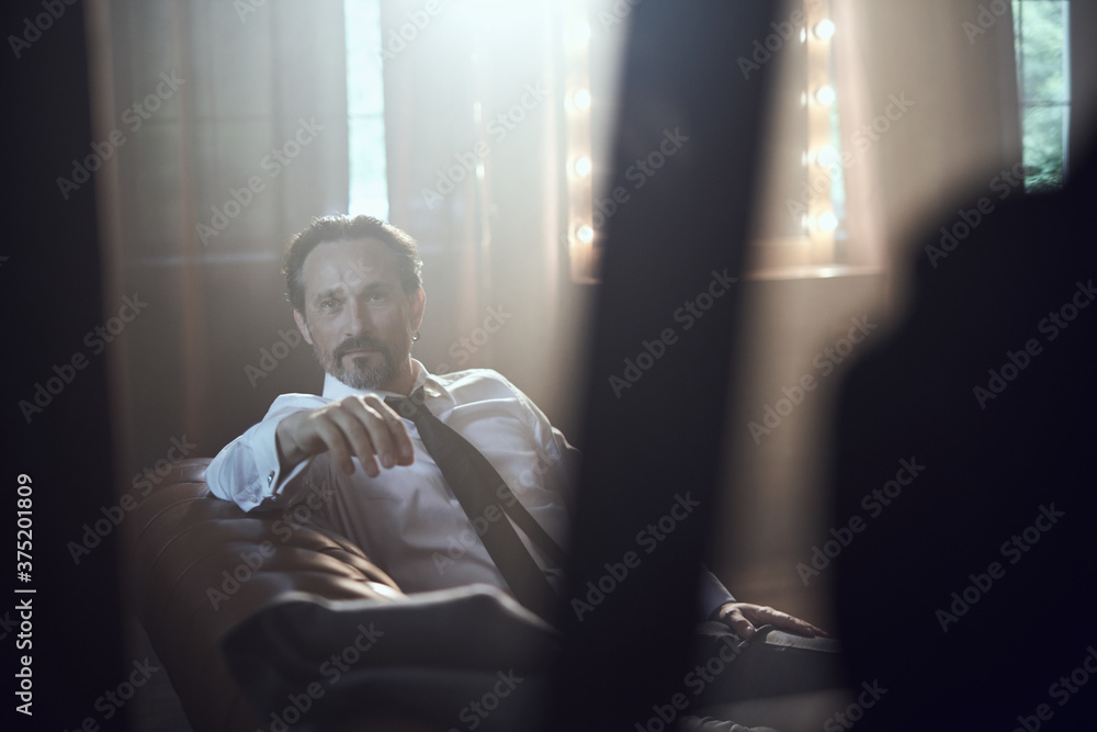 cinematic photo shoot of the confident actor celebrity look in foggy ...