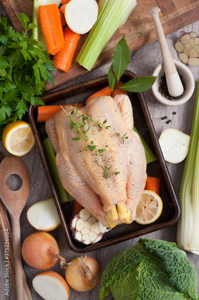 preparing roast chicken dinner Stock Photo | Adobe Stock