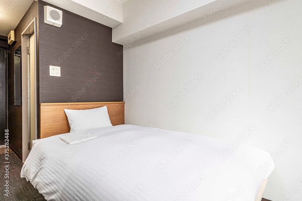 Single bed in modern small bedroom at apartment Stock Photo | Adobe Stock