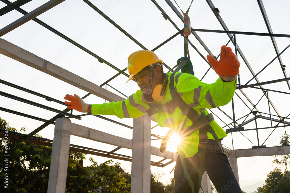 Construction workers fall from a height but have safety to help ...