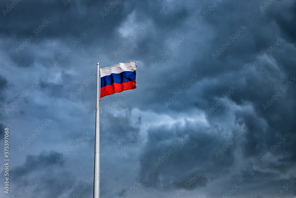 Russia flag waving on blue storm clouds sky background. Concept change ...