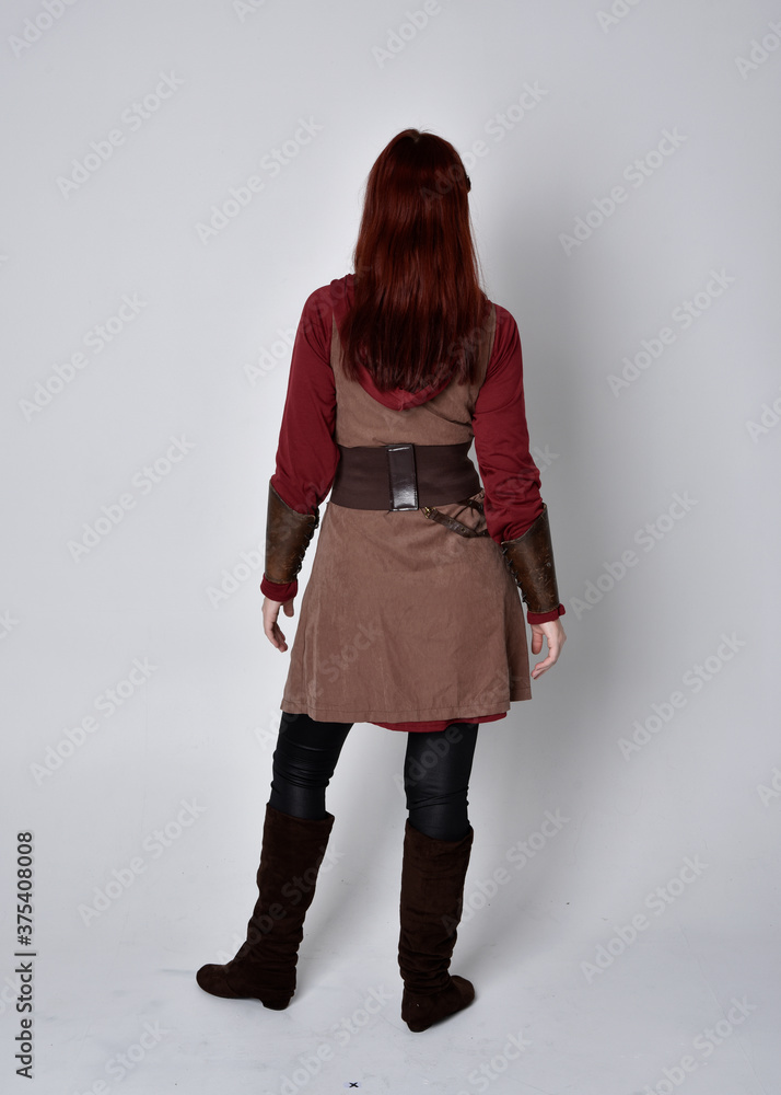 Full length portrait of girl wearing medieval costume. Standing pose ...