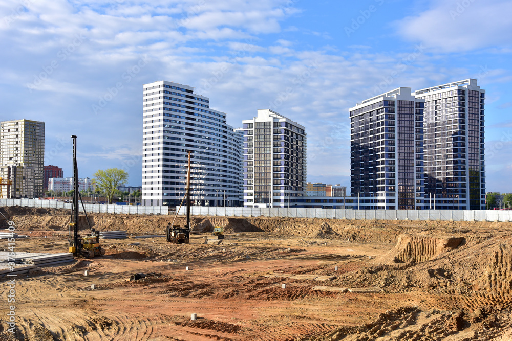 Construction site with machinery for deep foundation piling. Vibrating ...