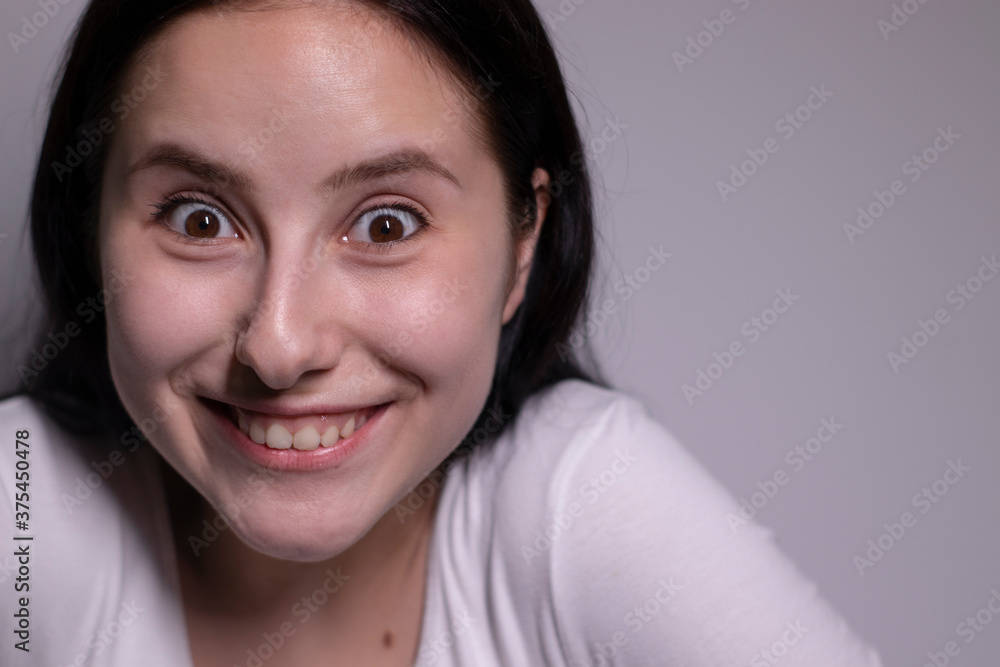 Indoor portrait of Beautiful smiling brunette with clean skin, natural ...