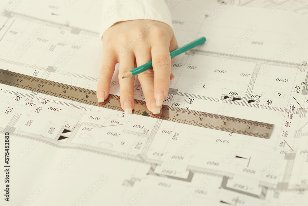 Architecture, design. The architect is working on a drawing in the ...