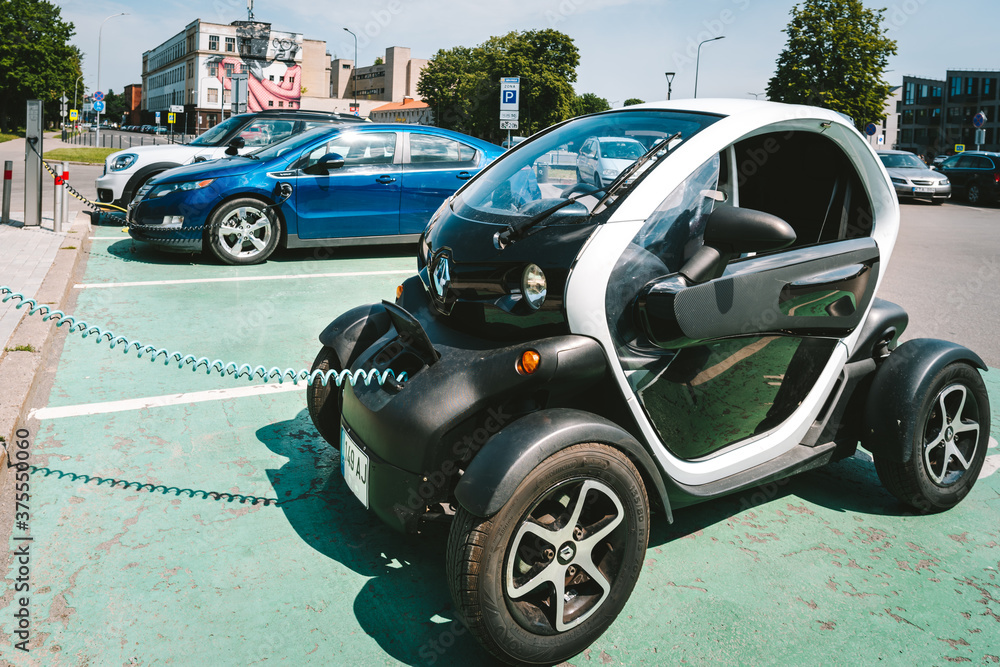 Charging Renault electric car. Twizy is a two-seat electric microcar ...