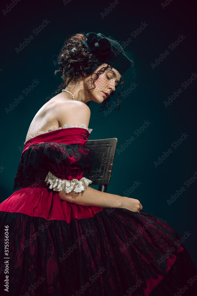 Love tragic. Young woman as Anna Karenina isolated on dark blue ...