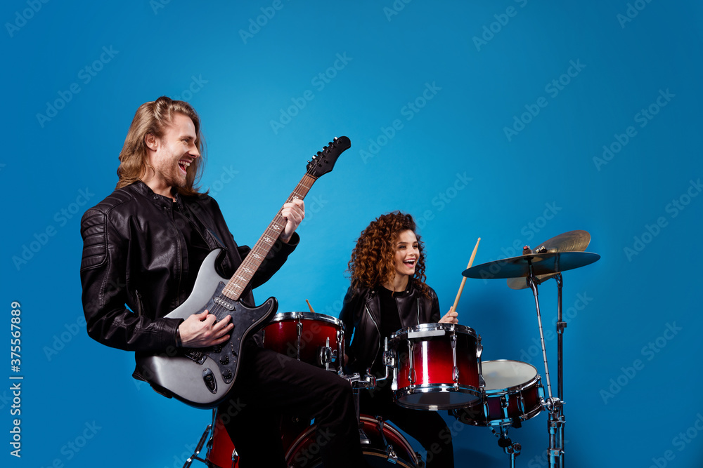 Profile side photo of funky youth rock band team guy two play bass ...