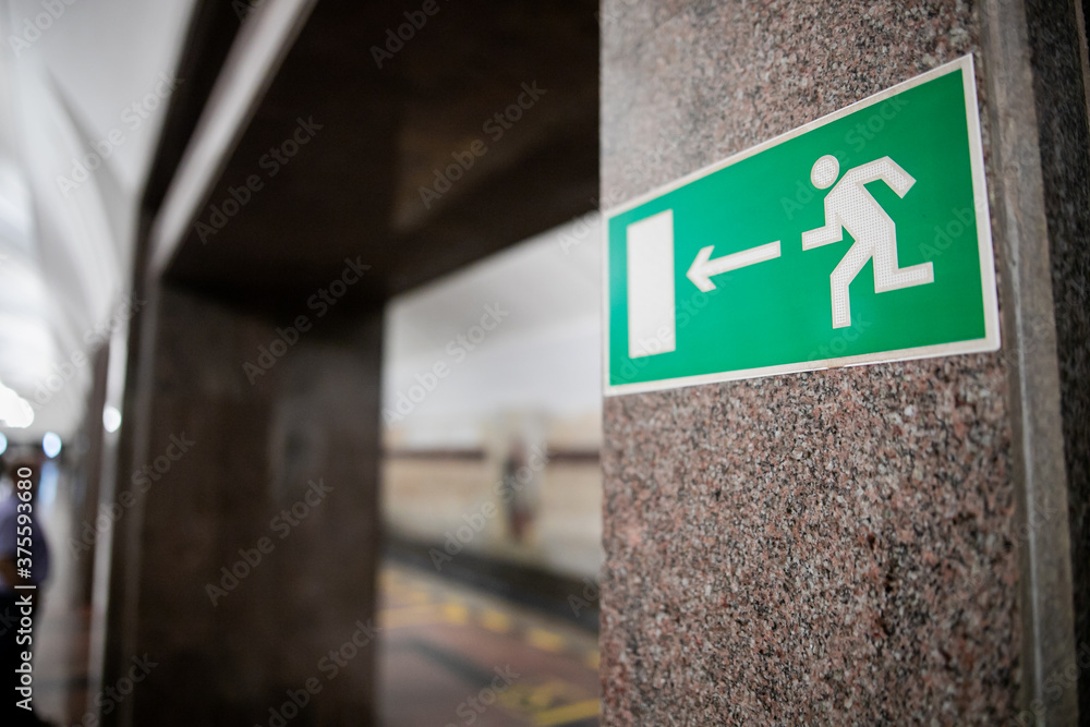Fire exit sign at the corridor in building Stock Photo | Adobe Stock