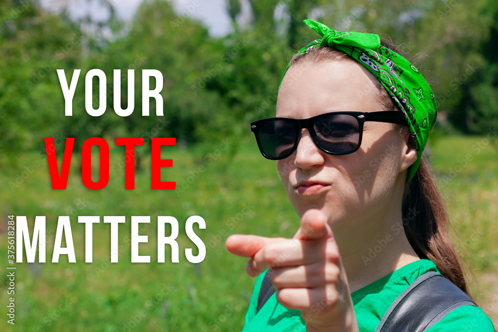 Girl shows a finger and looks at the camera with Your Vote Matters text ...