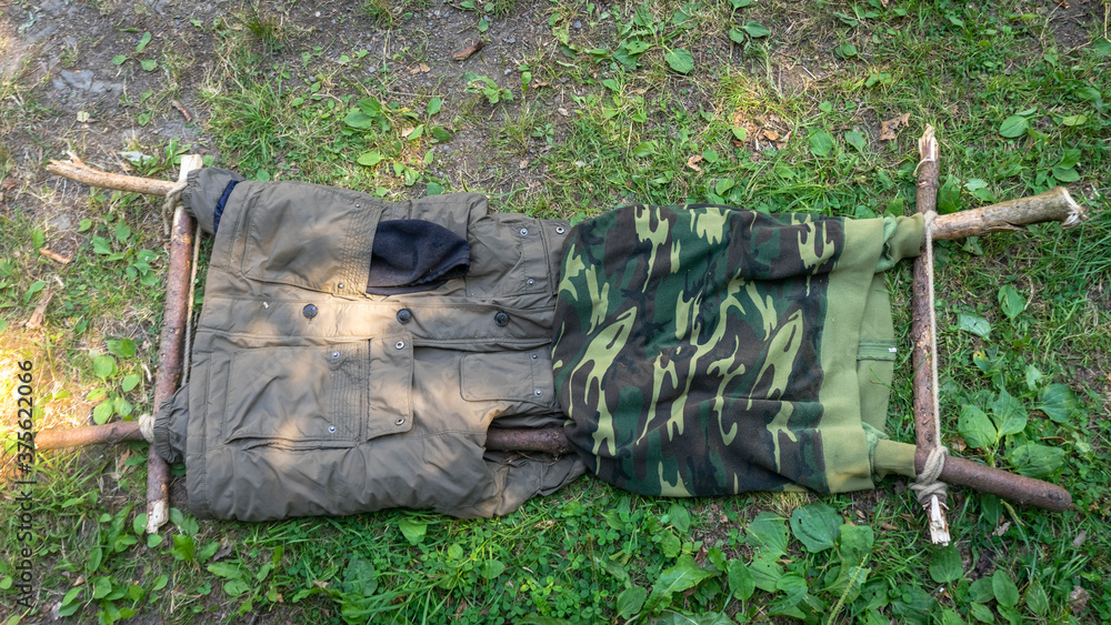 The first medical aid.The scouts made a sanitary stretcher out of ...