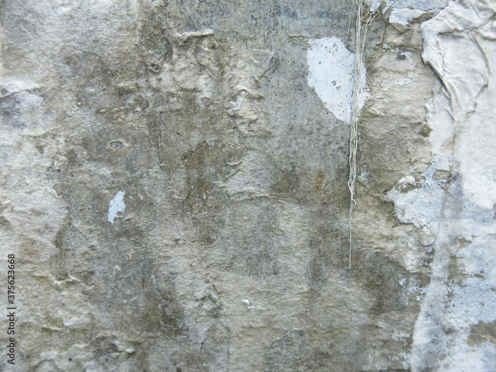 dirty rough concrete surface with scratches and scraps of ads, brutal ...