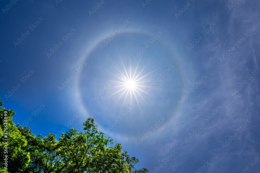 Sun with a circular rainbow,Fantastic beautiful sun halo phenomenon in ...
